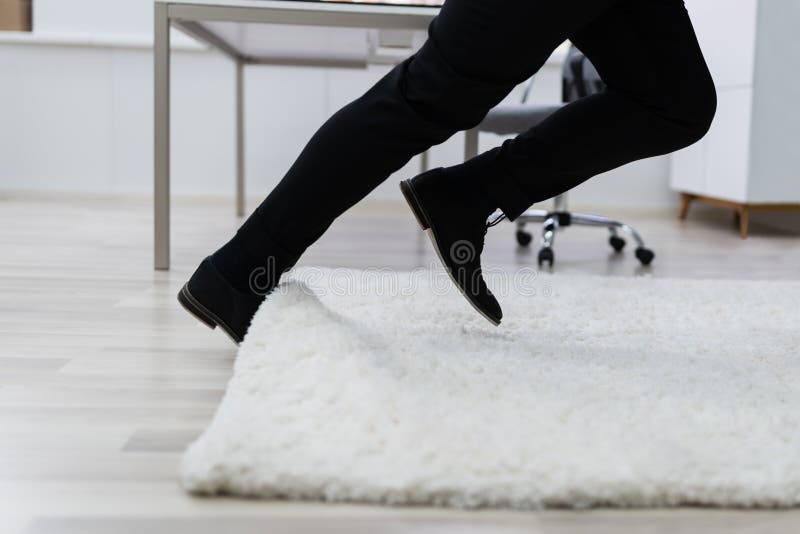 Man Stumble in a Carpet stock photo. Image of carpet - 211312258