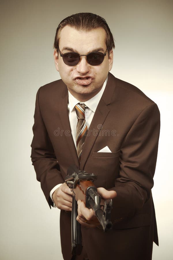 Man in Style of Organized Crime Posing with AK-47 Style Gun Stock Photo ...