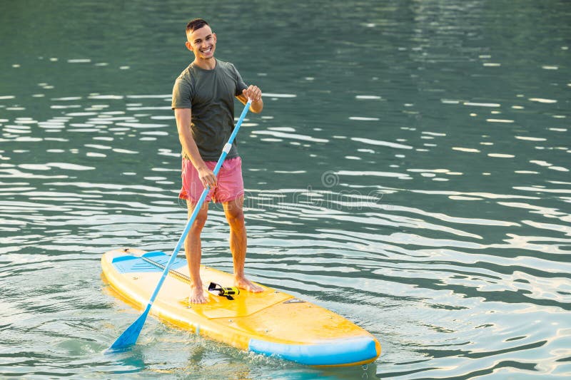 Man on Sub Board Floating on Ocean Sea. Stock Image - Image of boarding ...