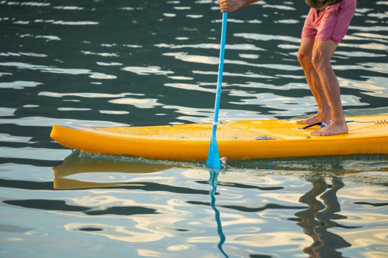 Man on Sub Board Floating on Ocean Sea. Stock Photo - Image of hand ...