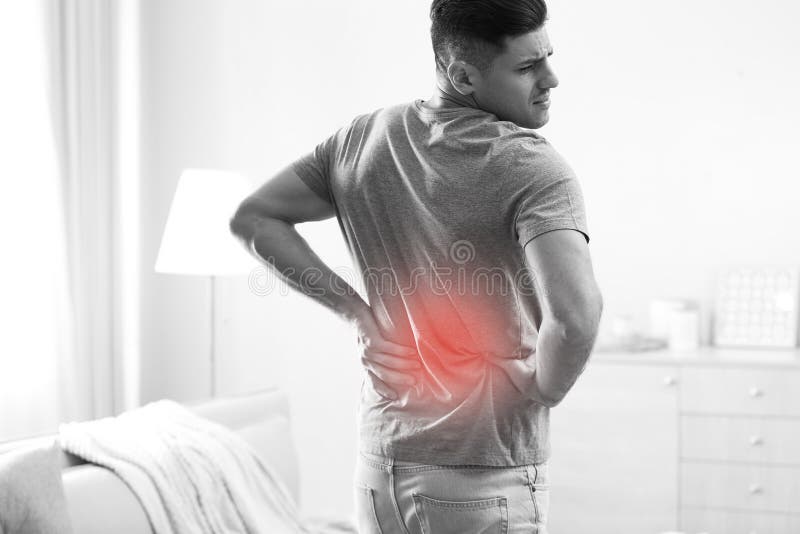 Man Suffering from Back Pain at Home. Bad Posture Problem Stock Photo ...