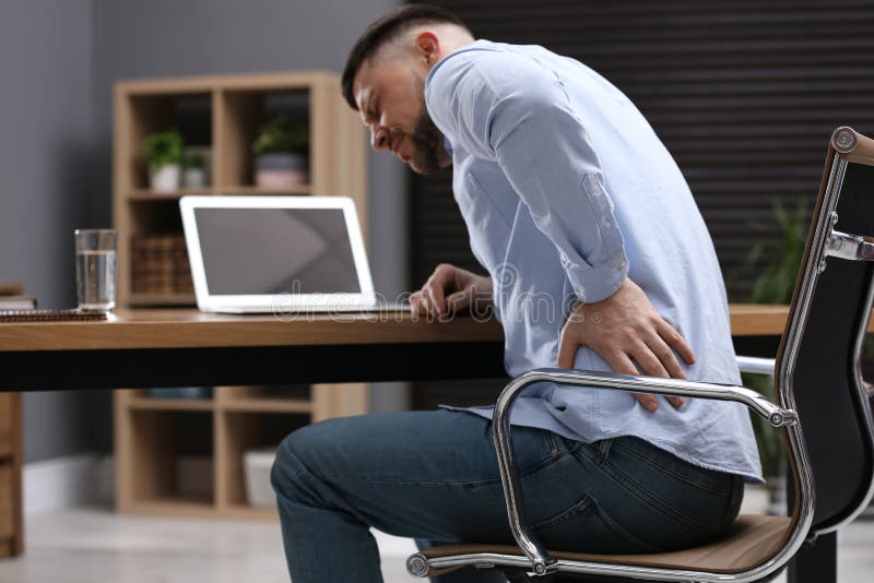 Man with Bad Posture Working on Computer in Office Stock Image - Image ...