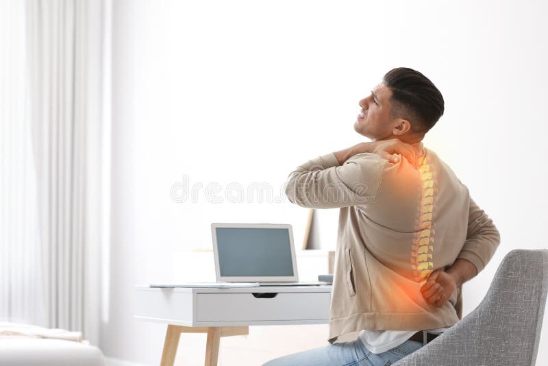 Man Suffering from Back Pain at Workplace. Bad Posture Problem Stock ...