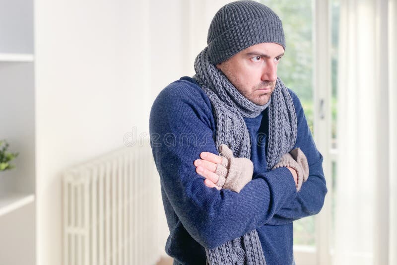 Man Suffering Cold at Home and Problem with House Heating Stock Photo ...