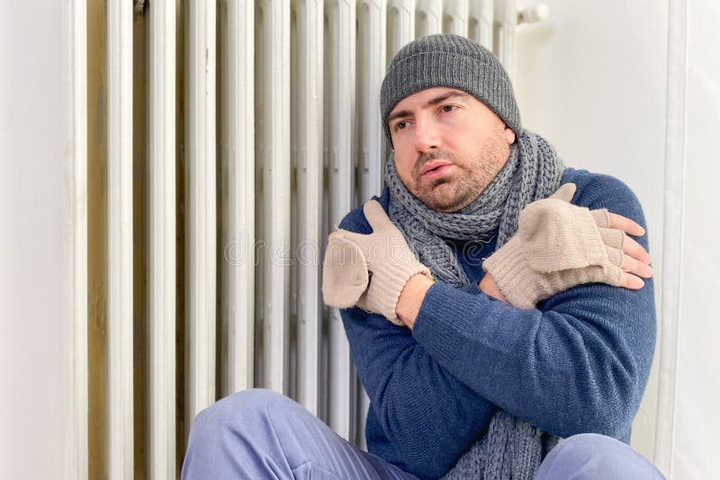 Man Suffering Cold at Home and Problem with House Heating Stock Photo ...
