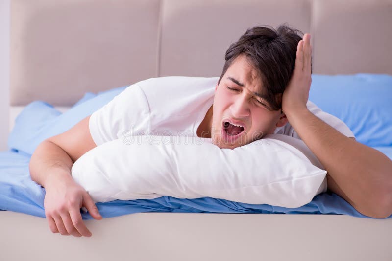 The Man Suffering from Insomnia Lying in Bed Stock Photo - Image of ...