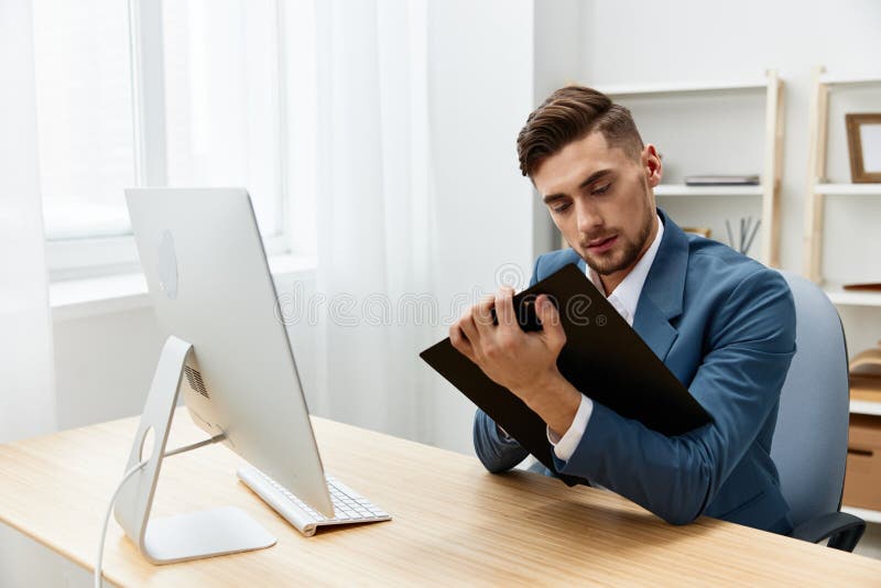 A Man in a Suit Computer Desktop Work Self-confidence Paper Folder ...