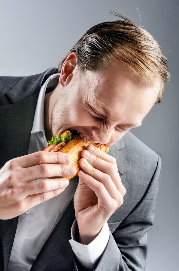 Man in Suit Eats BLT Eagerly Stock Photo - Image of lettuce, funny ...