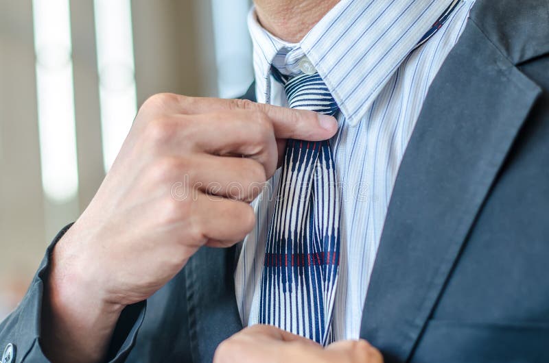 Man in a Suit Fixing His Tie. Stock Photo - Image of handsome ...