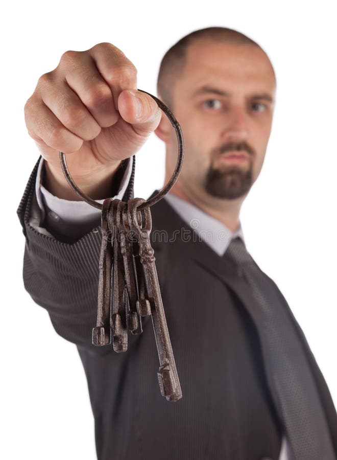 Man in Suit Giving Old Keys To a House Stock Image - Image of finance ...