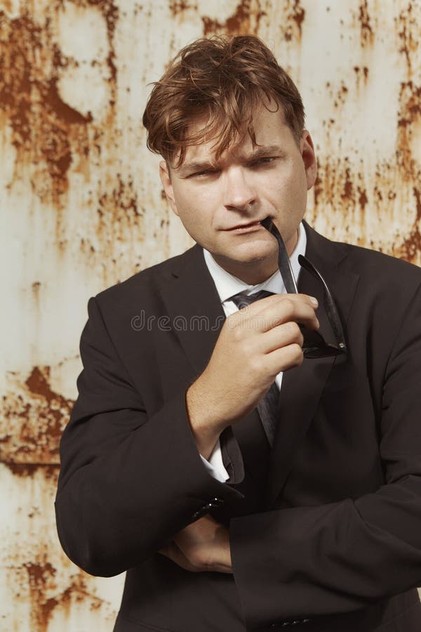 Man in Dark Suit and Tie Posing for Portrait by Rusty White Wall Stock ...