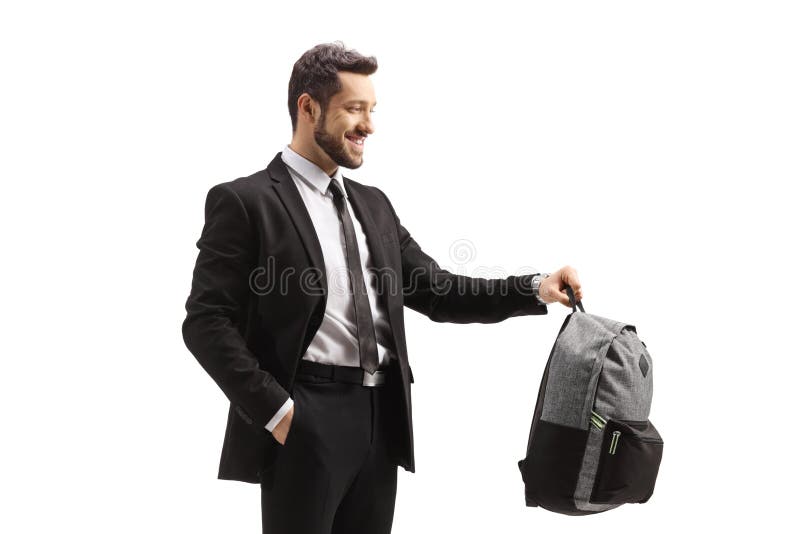 Man in a Suit Holding a Backpack Stock Image - Image of standing ...