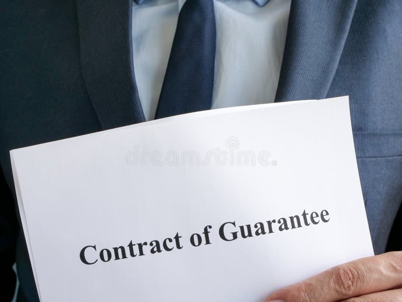 Man in Suit is Holding Contract of Guarantee. Stock Photo - Image of ...