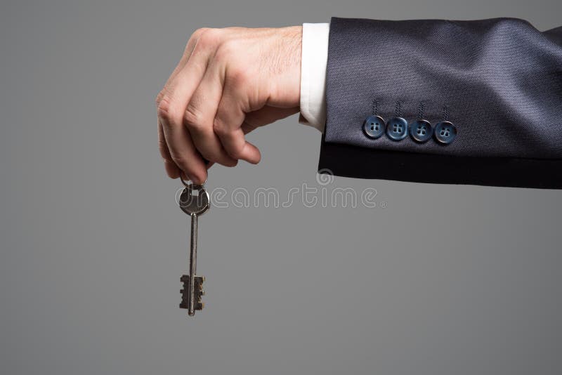 Man in Suit Holding Key in Hand. Stock Photo - Image of owner, holding ...