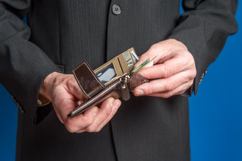 A Man in a Suit Holds a Wallet. Men& X27;s Hands Take Out or Put a Bill ...