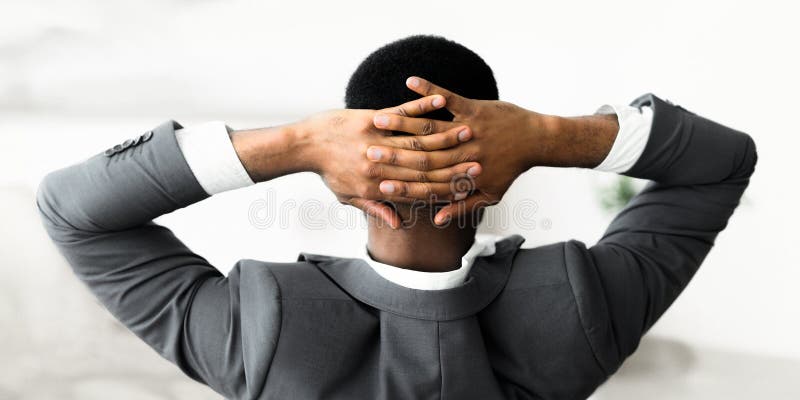 Man Leaning Back in Suit stock image. Image of arms - 335636259