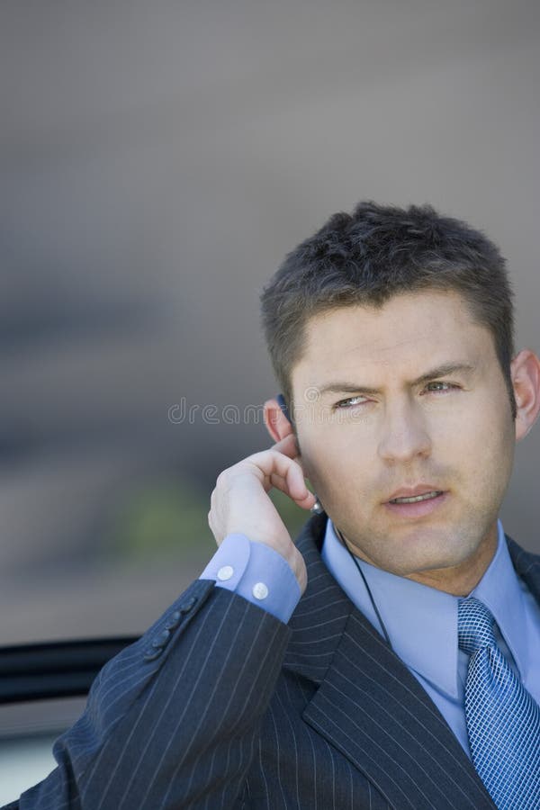 Serious Man in Suit at Library Desk Stock Image - Image of bookcase ...
