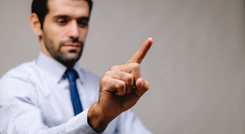 Man in a Suit is Pointing at Something on a Screen Stock Image - Image ...