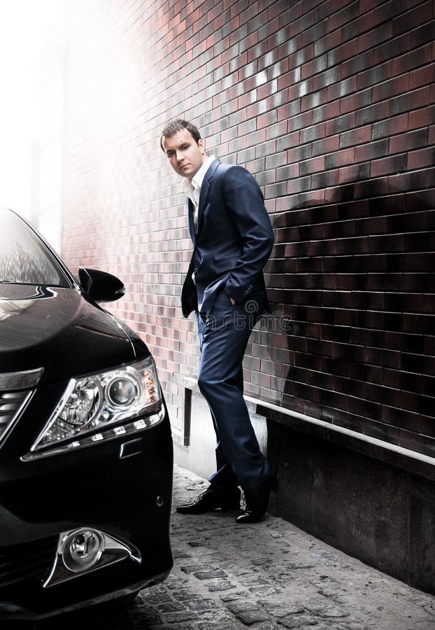 Man in Suit Posing Near Car Stock Image - Image of assistance, macho ...