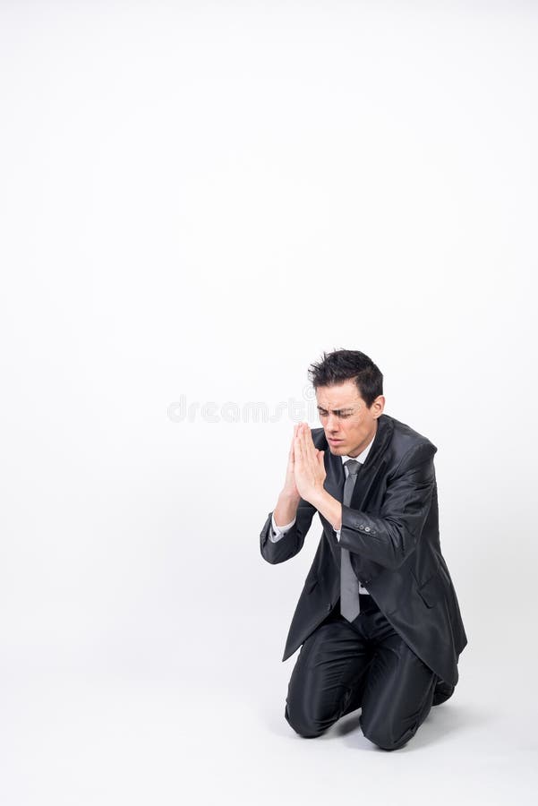 Man in suit praying stock photo. Image of lonely, desperate - 178601174