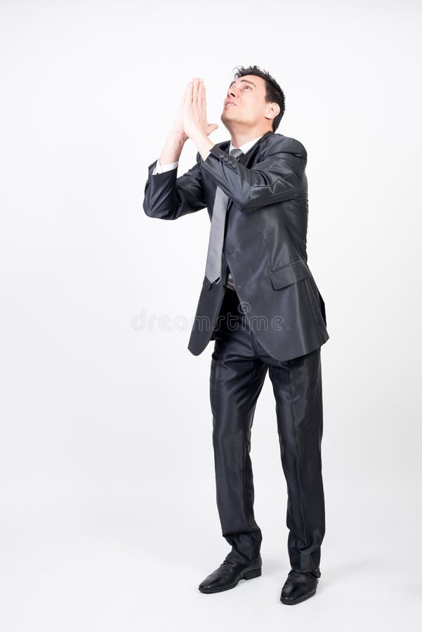 Man in suit praying stock photo. Image of lonely, desperate - 178601174