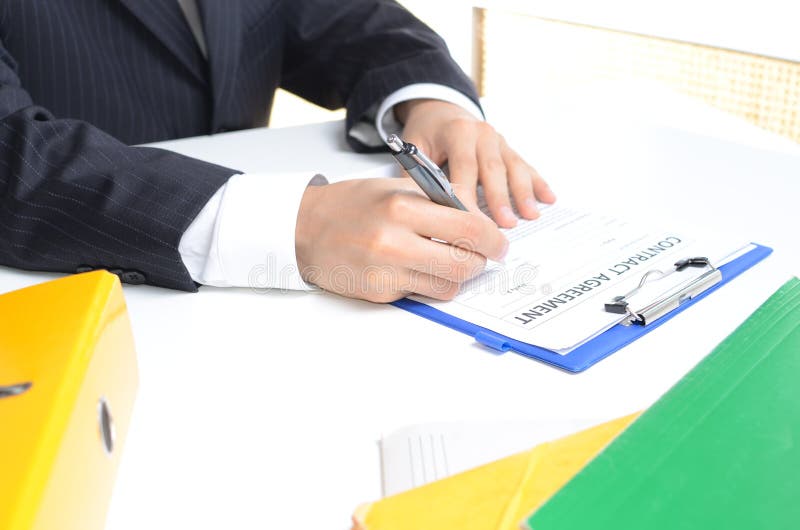 Man in Suit Signing Documents Stock Image - Image of professional ...