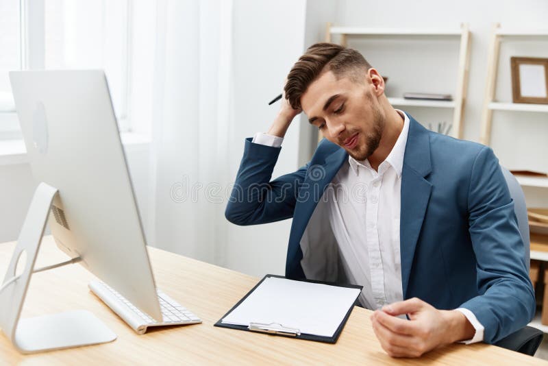 A Man in a Suit Sitting at the Computer Work Boss Documentation ...