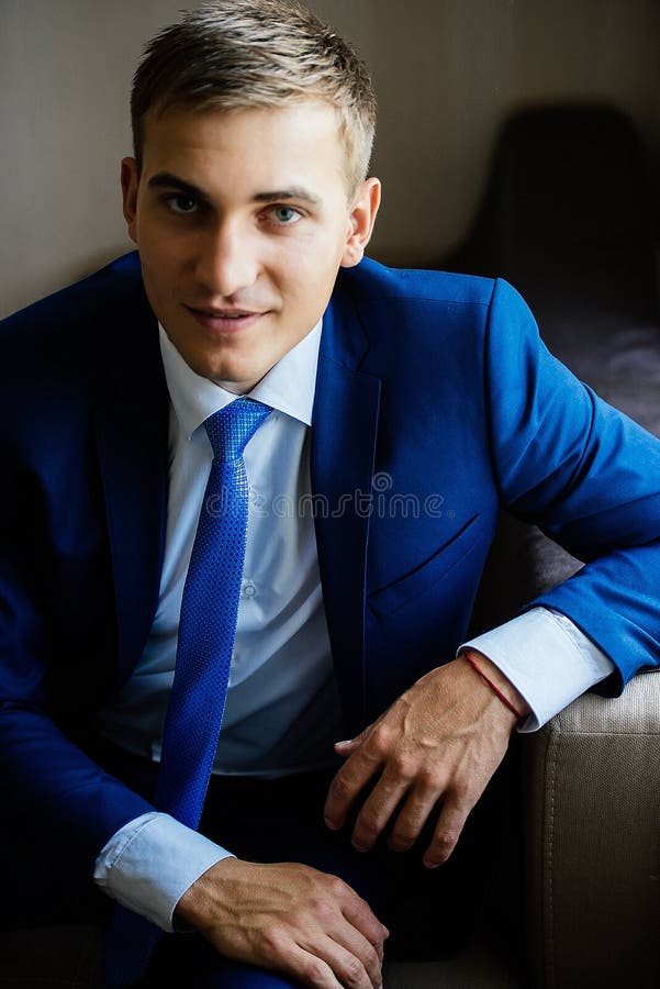 Man in a Suit is Sitting on the Sofa. Man Portrait Stock Image - Image ...