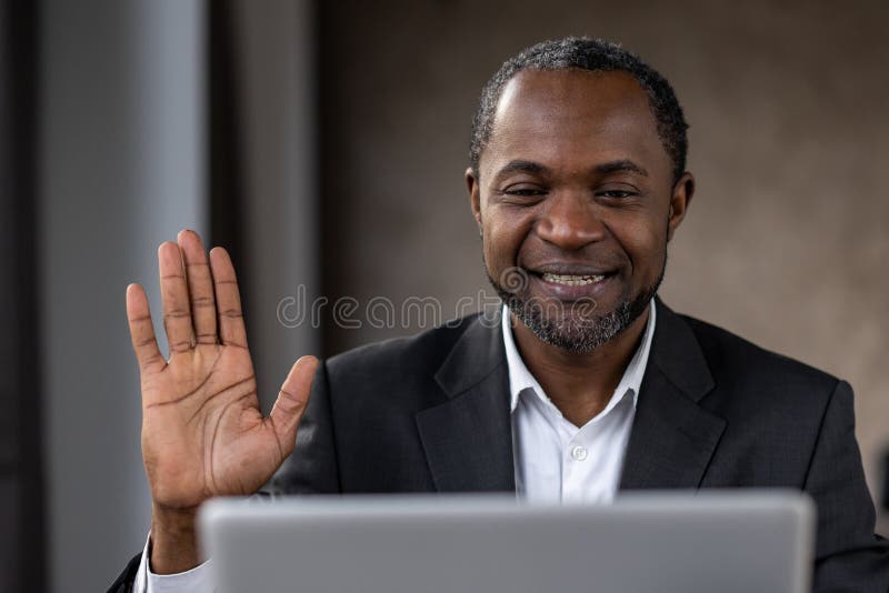 A Man in a Suit is Smiling and Waving at the Camera Stock Image - Image ...