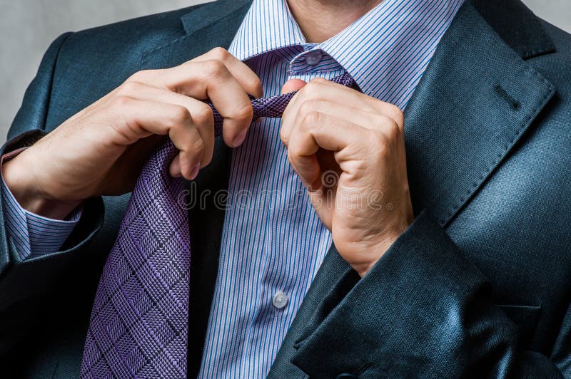 Man in Suit Untying His Neck Tie Stock Image - Image of necktie, male ...