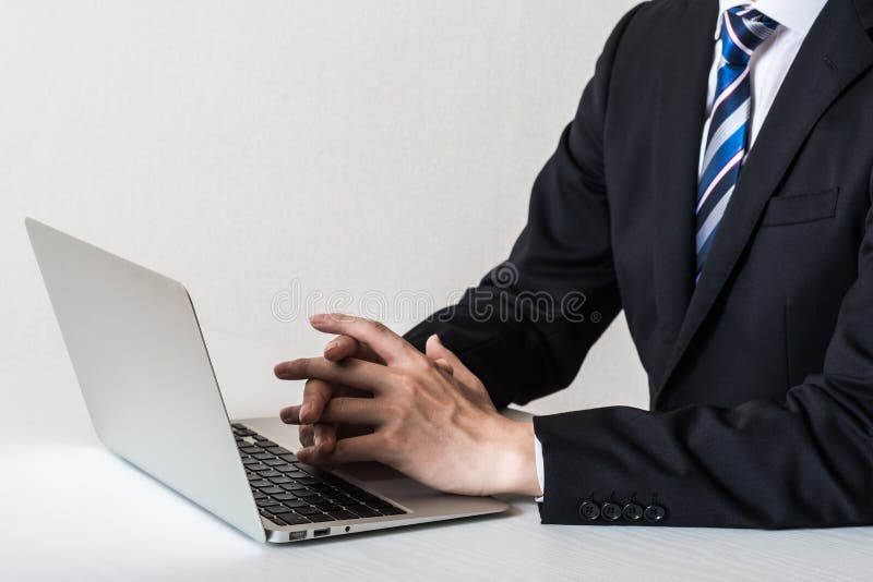 A Man in a Suit Watching a PC Stock Photo - Image of learn, decision ...