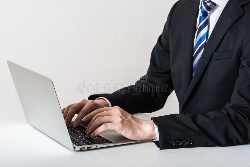 A Man in a Suit Watching a PC Stock Photo - Image of japan, business ...