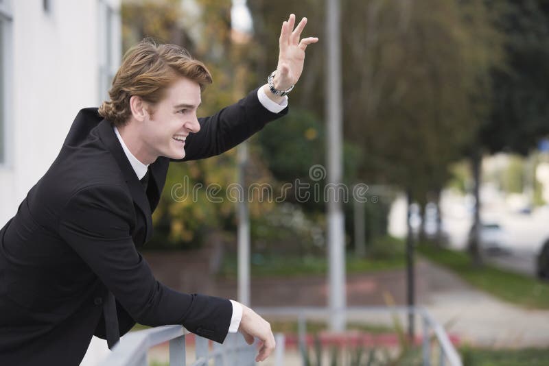 Man in Suit Waving at Someone Stock Photo - Image of boss, confident ...