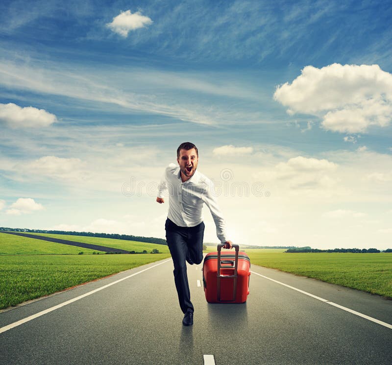 Man with Suitcase Running on the Road Stock Image - Image of young ...