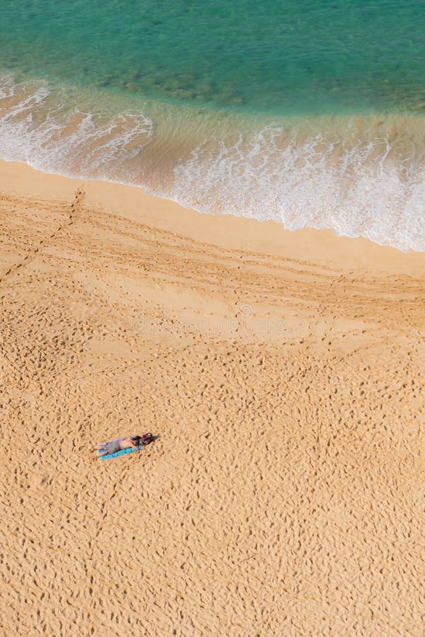 Man Sun Bathing Solo on Secluded Beach Stock Image - Image of flip ...
