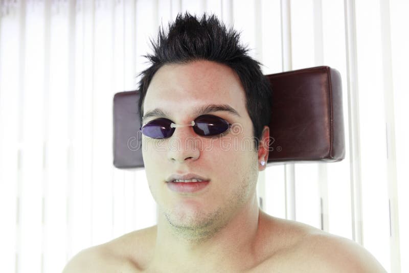 A Man in a Sunbath Receiving High Degree of Stock Photo - Image of ...