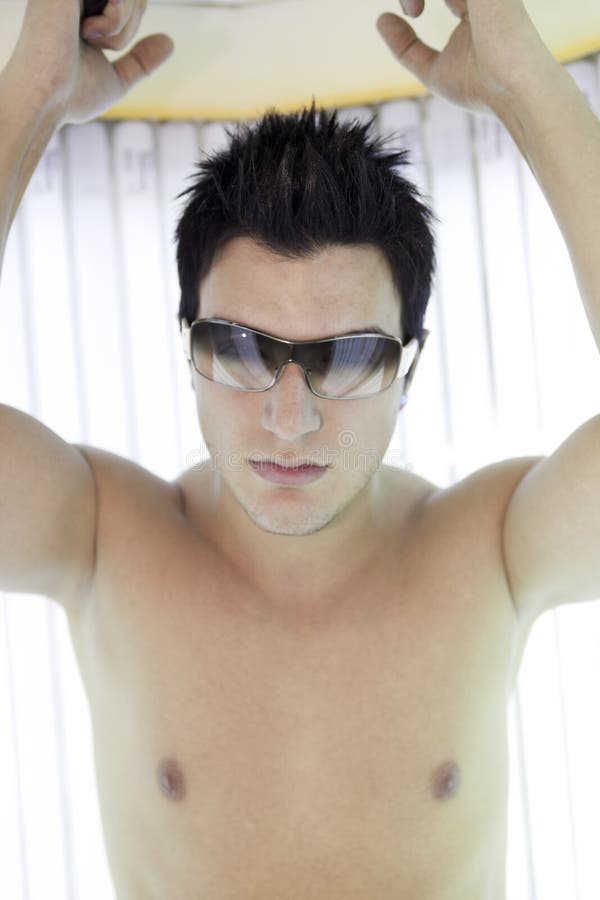 A Man in a Sunbath Receiving High Degree of Stock Photo - Image of ...