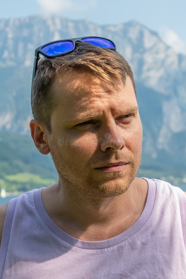 Man with Sunglasses Looking Away in Mountain Landscape Stock Photo ...