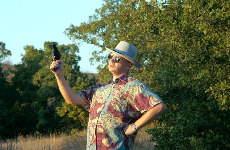 Man with a revolver stock photo. Image of strong, long - 32775896