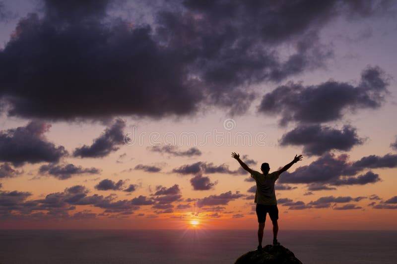 Man at Sunset. Man with Arms Up at Sunset in Front of the Sea Stock ...