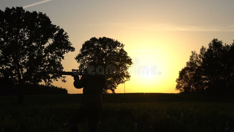 Man on a Sunset Background with Gun Slow Stock Footage - Video of ...