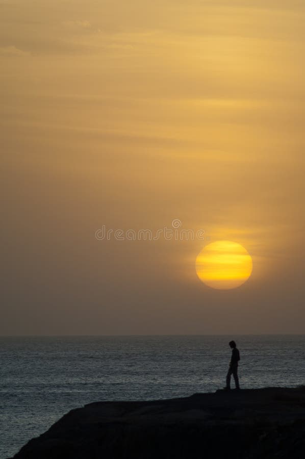 Man at Sunset in the Coast of Dakar. Stock Photo - Image of colors ...