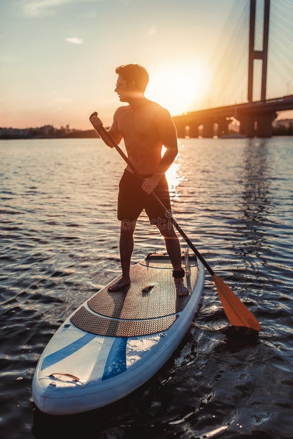 Man on SUP board stock photo. Image of holidays, paddling - 97893278