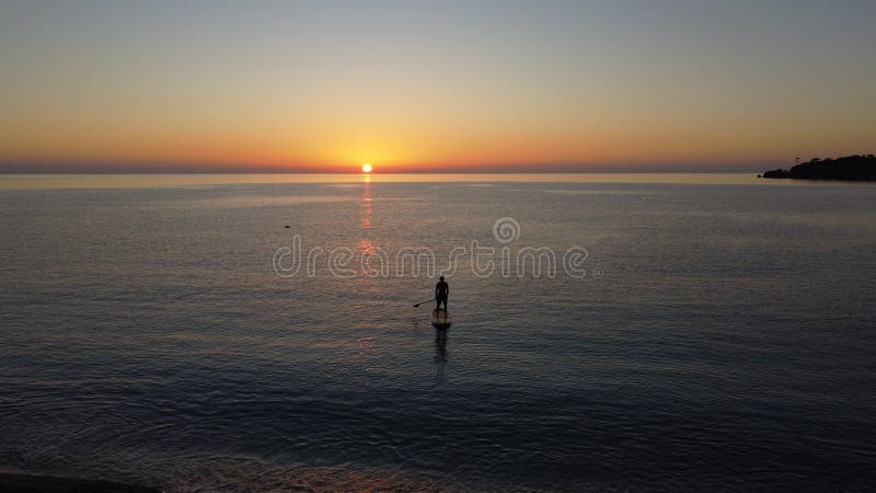 Man on a Sup Board at Sunset Stock Image - Image of standup, paddling ...