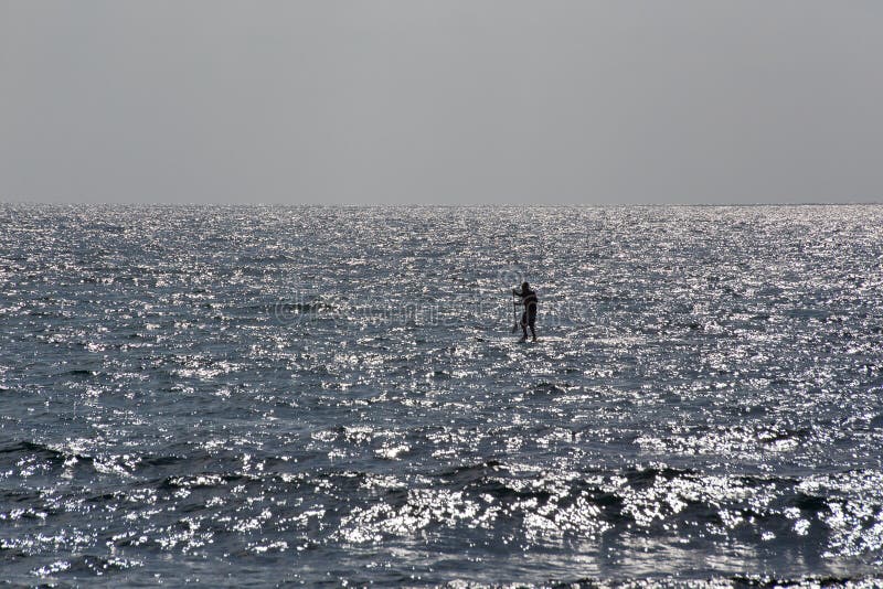 Man on the Surfboard on the Sea in Sunset Silver Hotspots. Stock Image ...