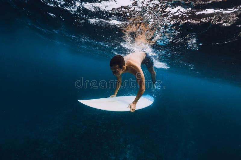 Man Surfer with Surfboard Dive Underwater of Big Ocean Wave. Stock ...