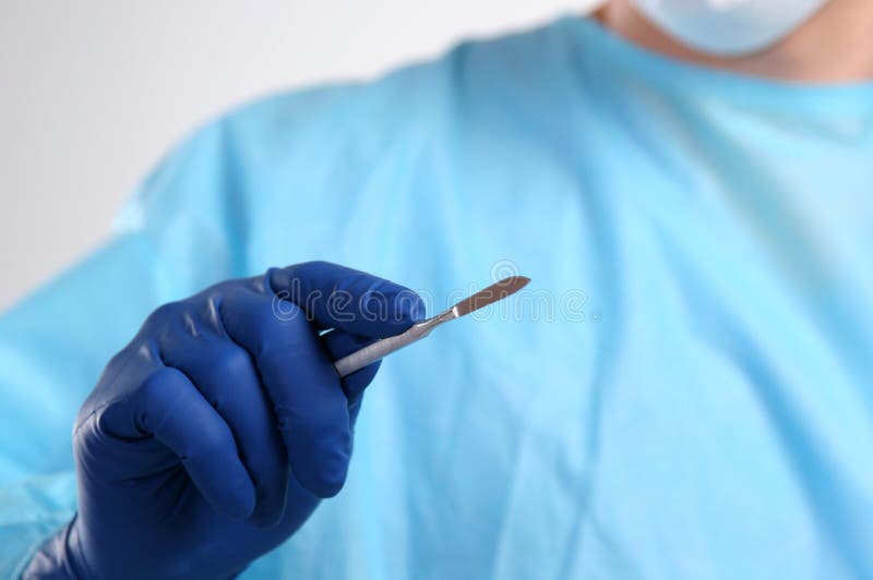 Surgeon Hand Hold Scalpel and Tweezers while Cut Cure Wound Closeup ...