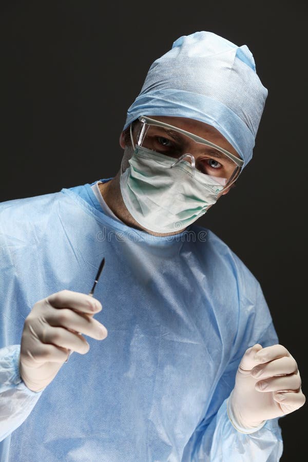 Man Surgeon Holds a Scalpel in an Operating Room Stock Photo - Image of ...
