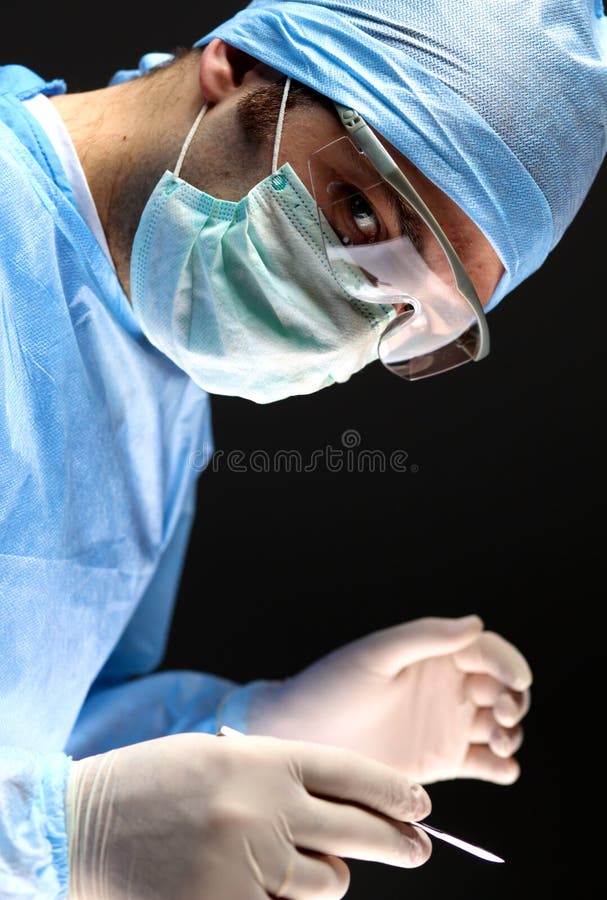 Man Surgeon Holds a Scalpel in an Operating Room Stock Image - Image of ...
