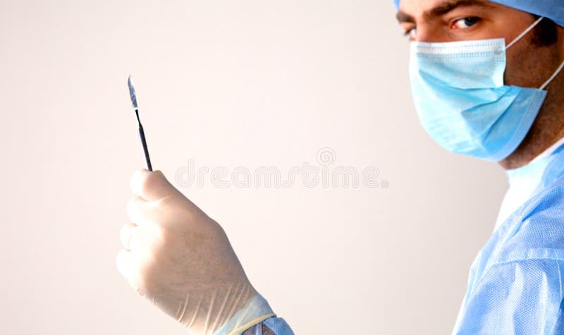 Man Surgeon Holds a Scalpel in an Operating Room Stock Photo - Image of ...